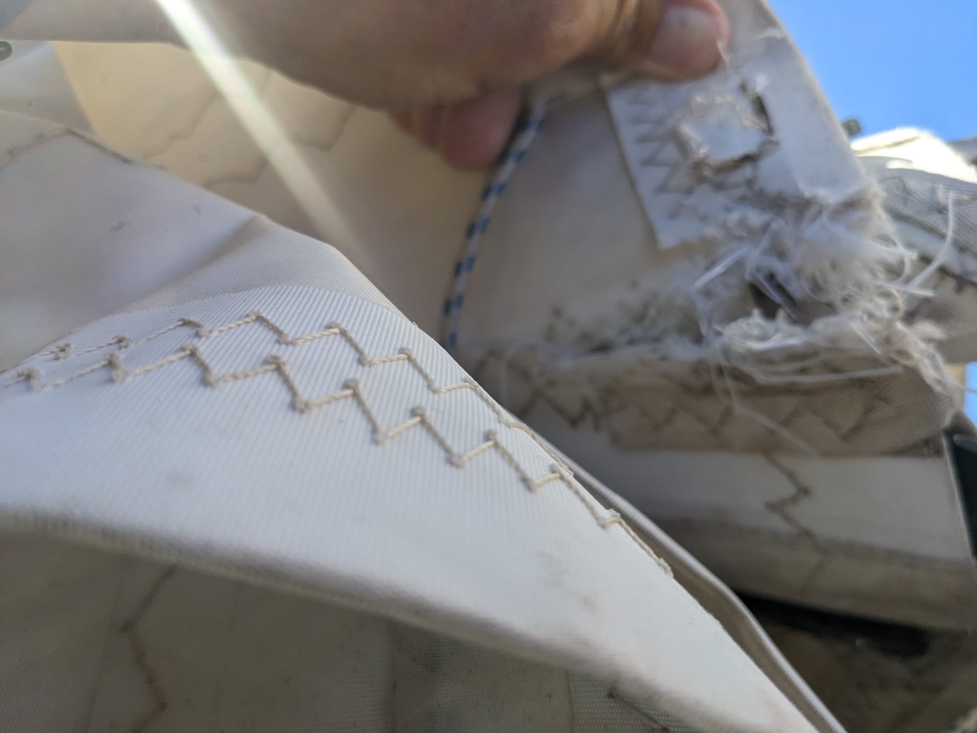 Pacific Crossing – Day 15 -main sail patching – Sailing Bear and Seal